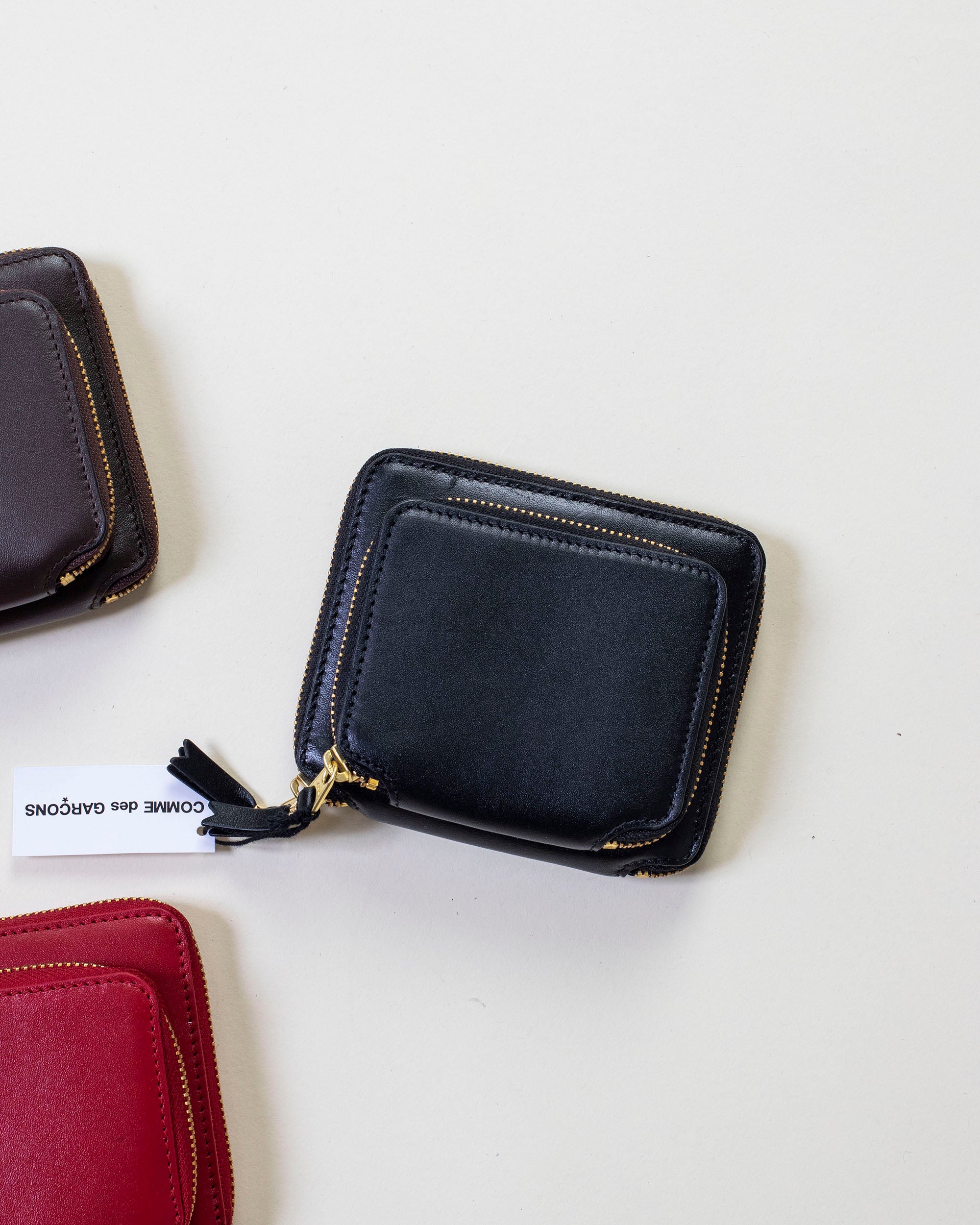 comme des garçons outside pocket zip around wallet | noodle stories